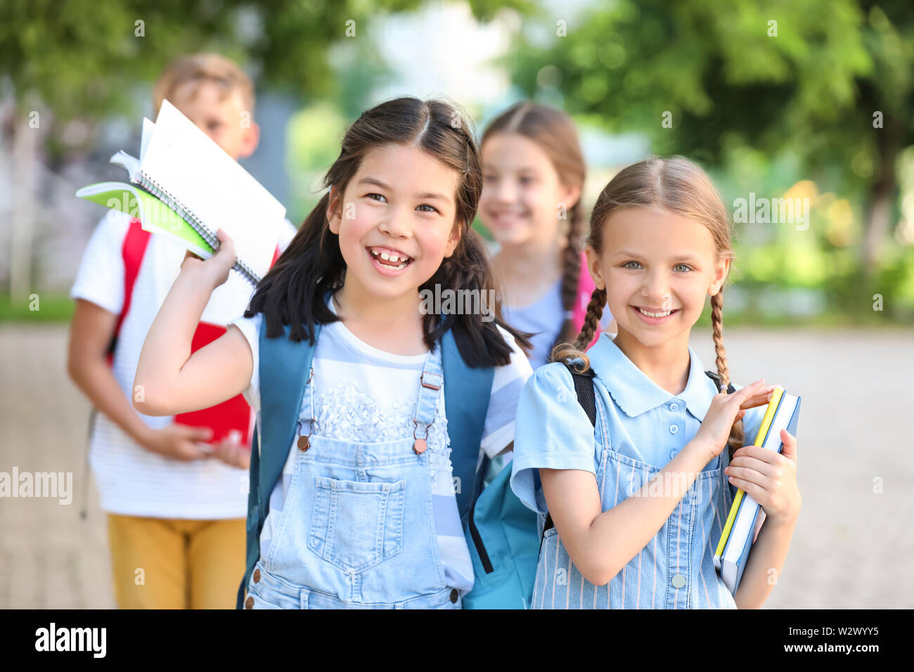 Group of cute little pupils outdoors Stock Photo - Alamy