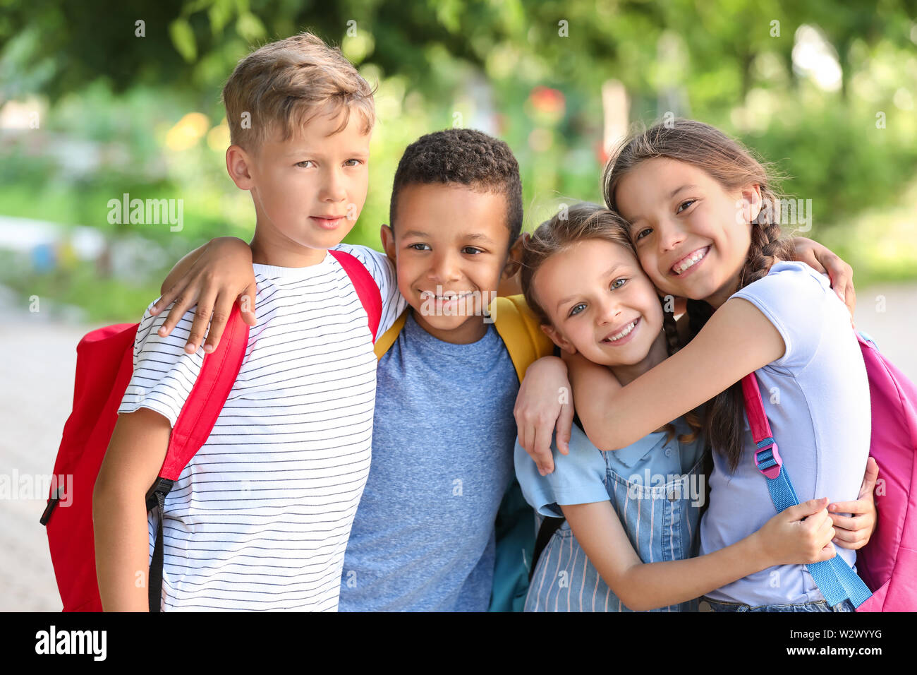 Group of cute little pupils outdoors Stock Photo - Alamy