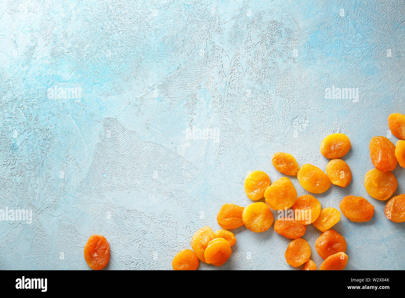 Tasty dried apricots on light background Stock Photo - Alamy