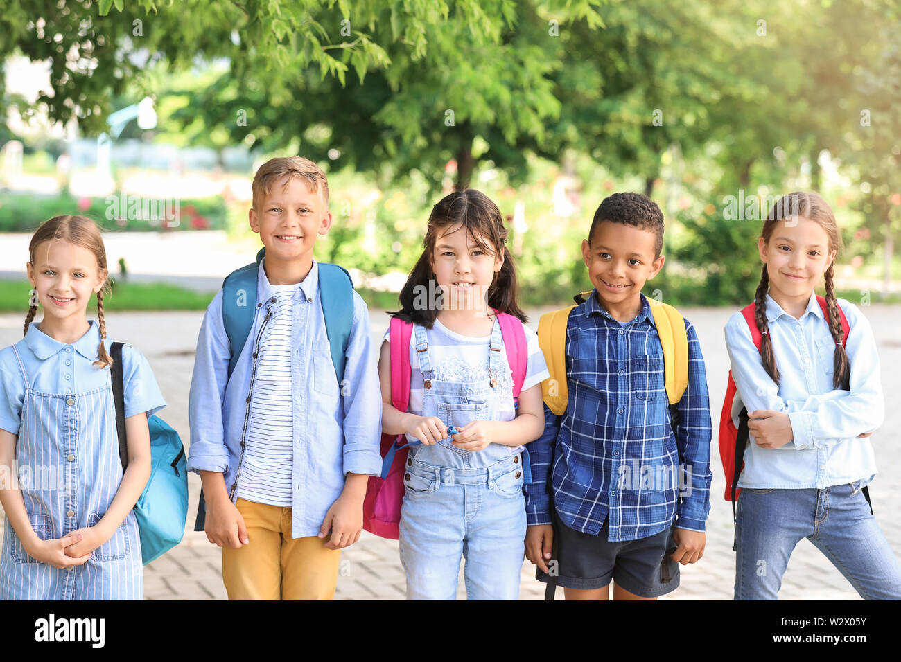 Group of cute little pupils outdoors Stock Photo - Alamy