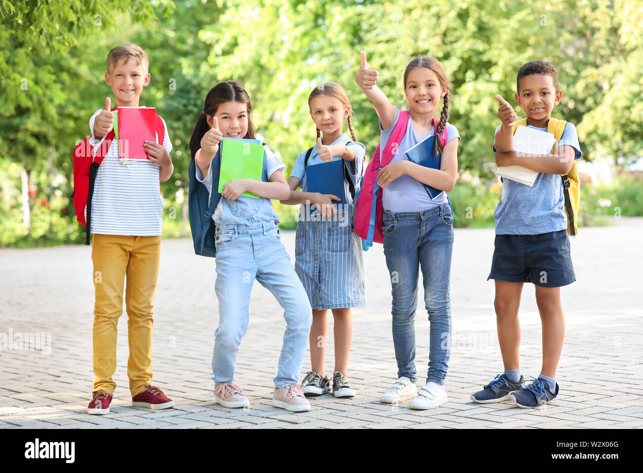 Group of cute little pupils outdoors Stock Photo - Alamy