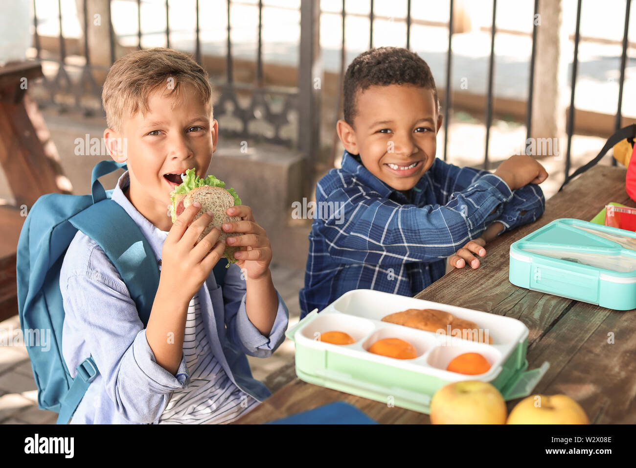 Little children having lunch outdoors Stock Photo - Alamy