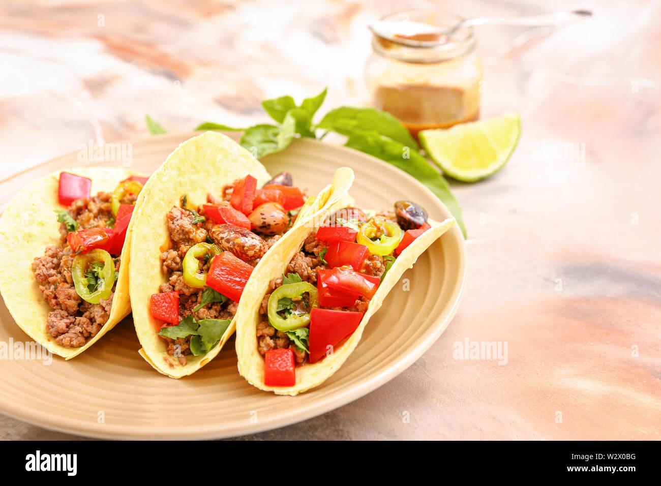 Plate with tasty fresh tacos on marble background Stock Photo - Alamy