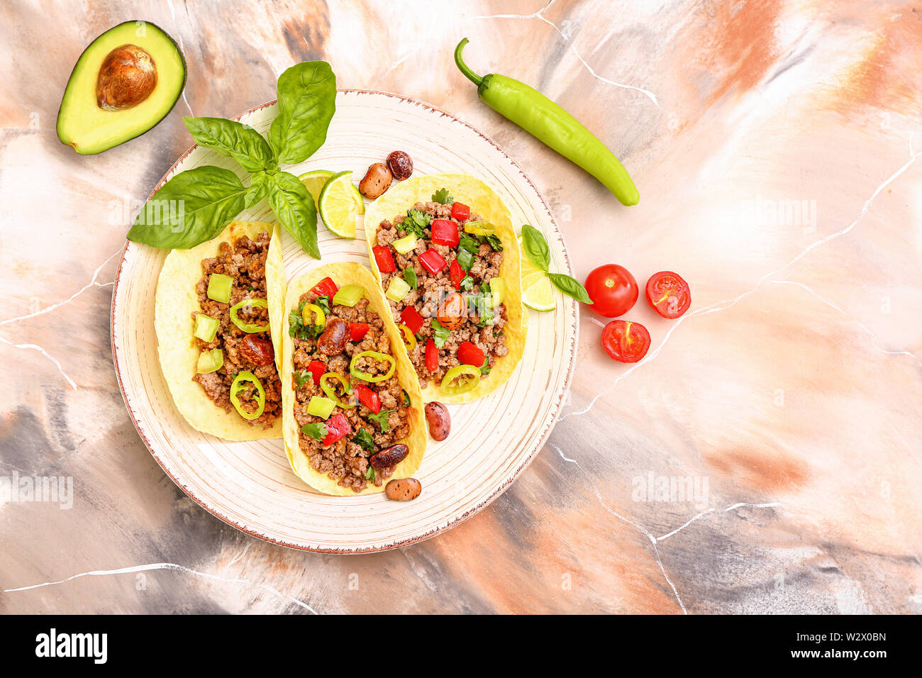 Plate with tasty fresh tacos on marble background Stock Photo - Alamy