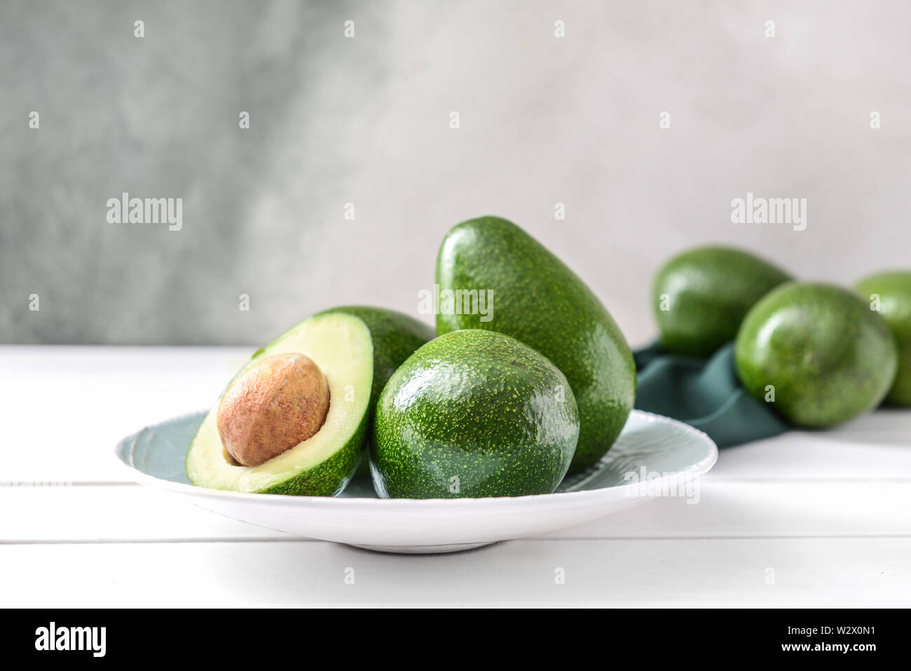 Avocados white plate hi-res stock photography and images - Alamy