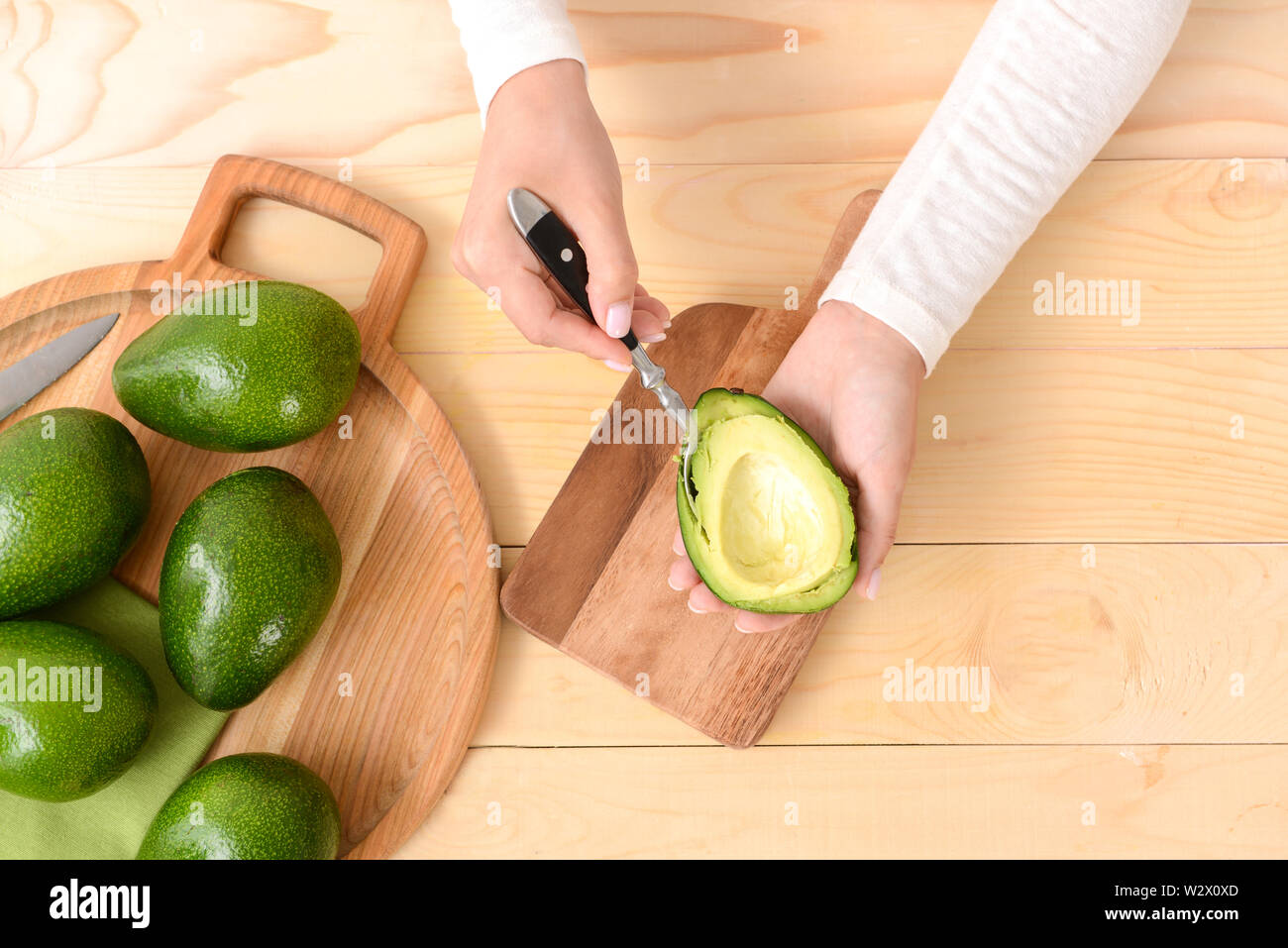 Woman fresh avocados table hi-res stock photography and images - Alamy