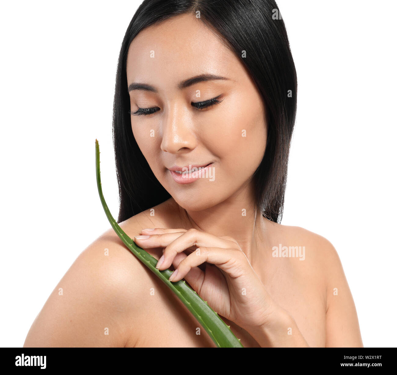 Beautiful Asian woman with aloe vera on white background Stock Photo ...
