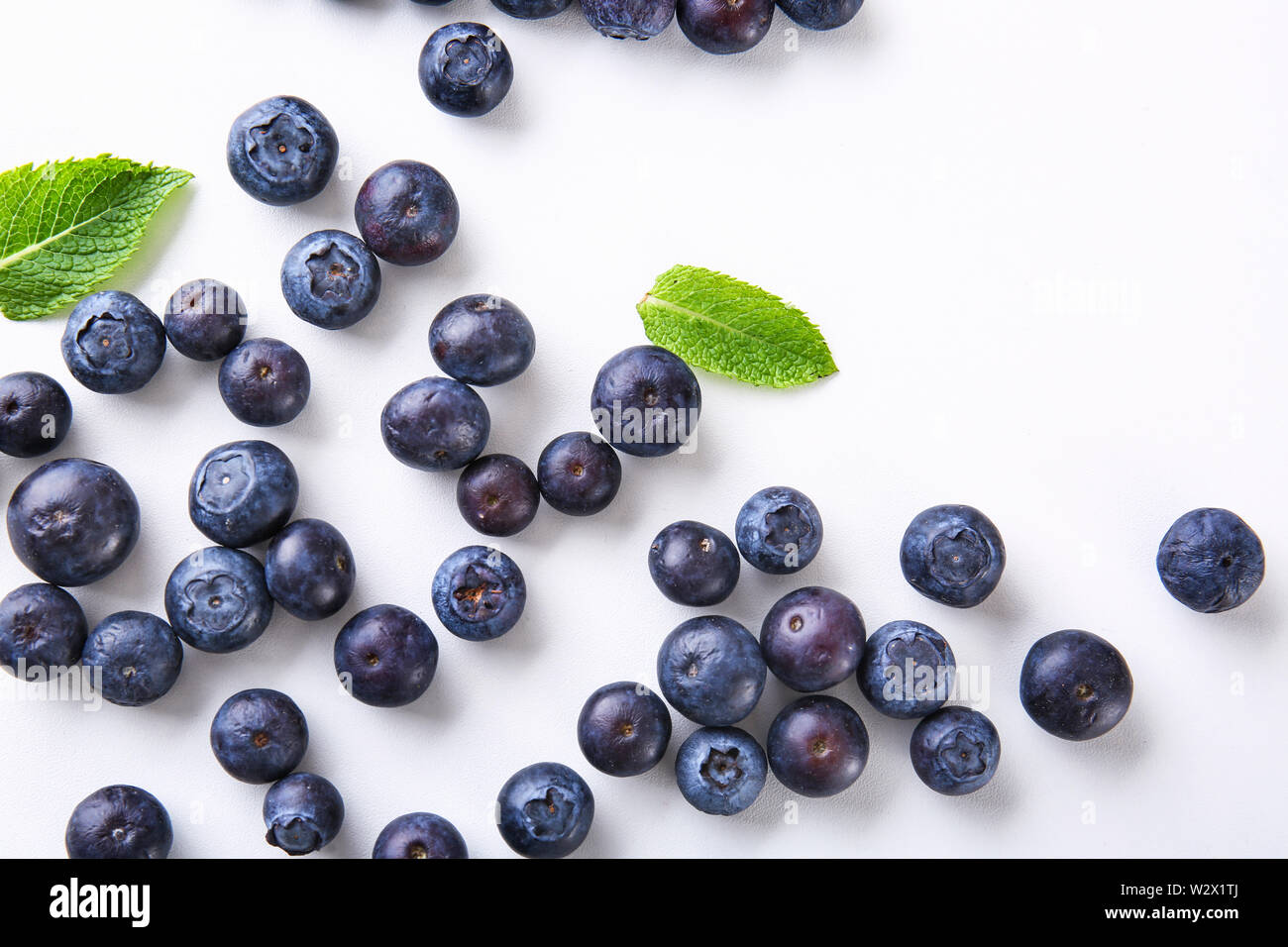 Ripe blueberry on white background Stock Photo - Alamy