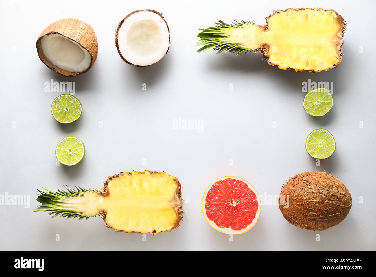 Frame made of different fruits on light background Stock Photo - Alamy