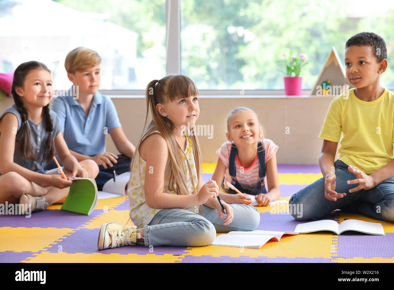Cute children in primary school Stock Photo - Alamy