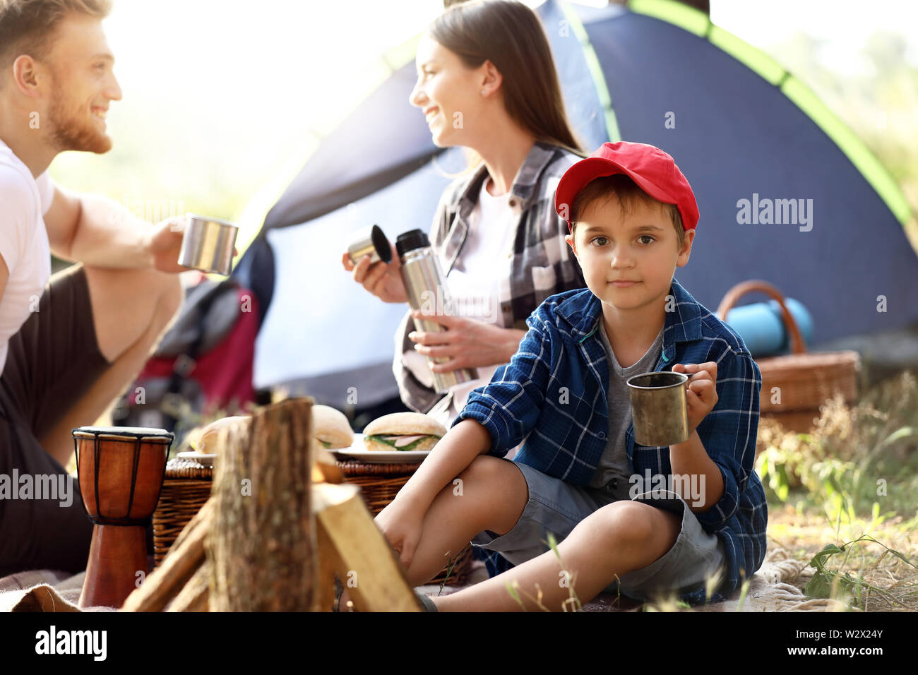 Little boy with family spending weekend in forest Stock Photo - Alamy