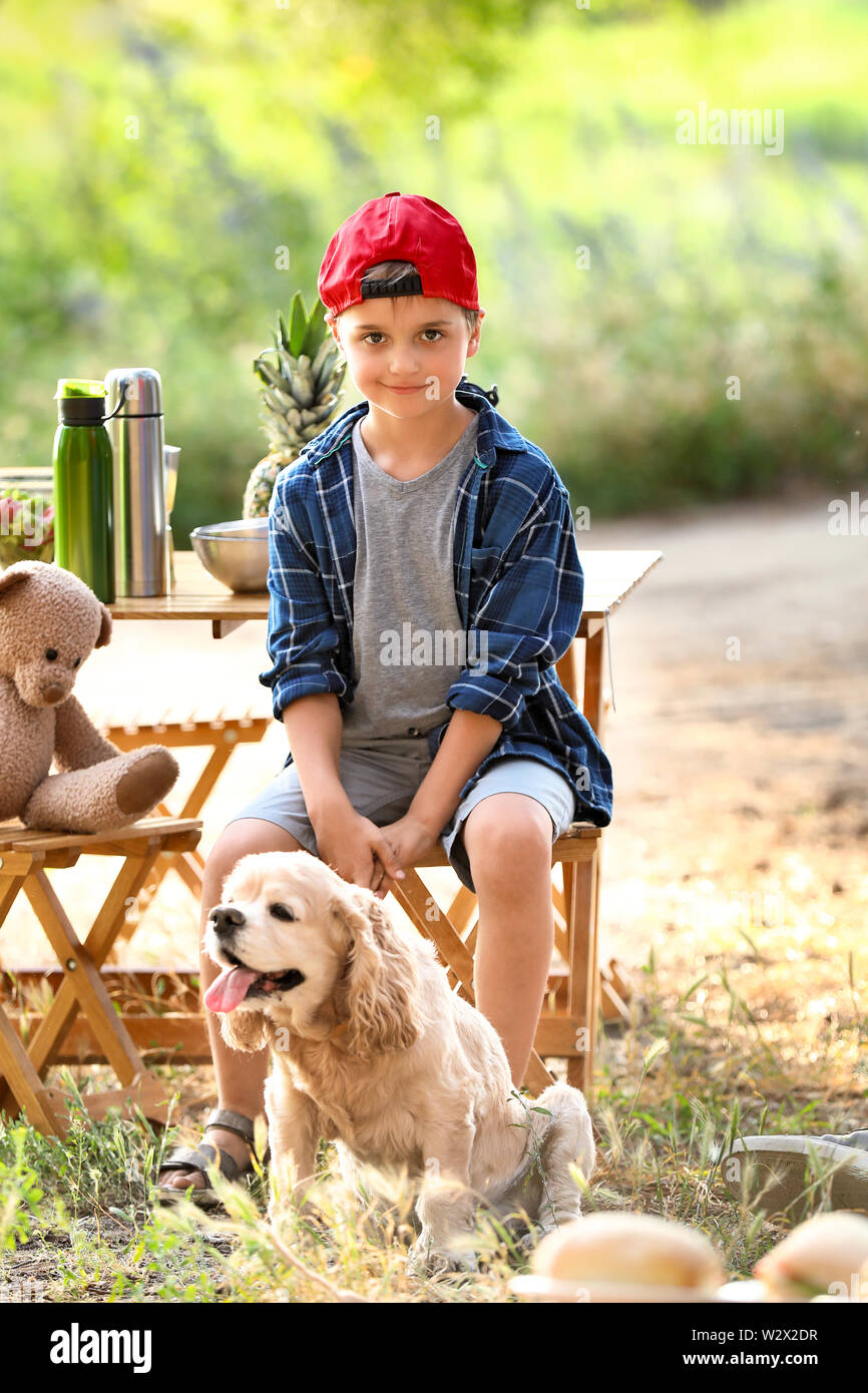 Little boy with cute dog spending weekend in forest Stock Photo - Alamy