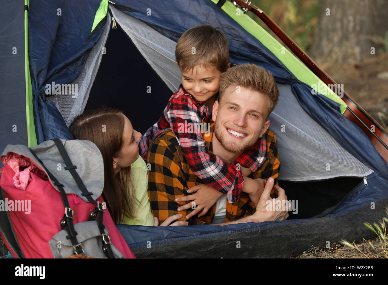 Happy family spending weekend in forest Stock Photo - Alamy
