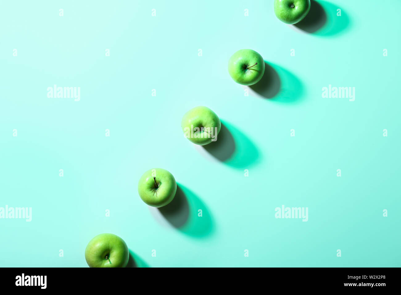 Tasty apples on color background Stock Photo - Alamy