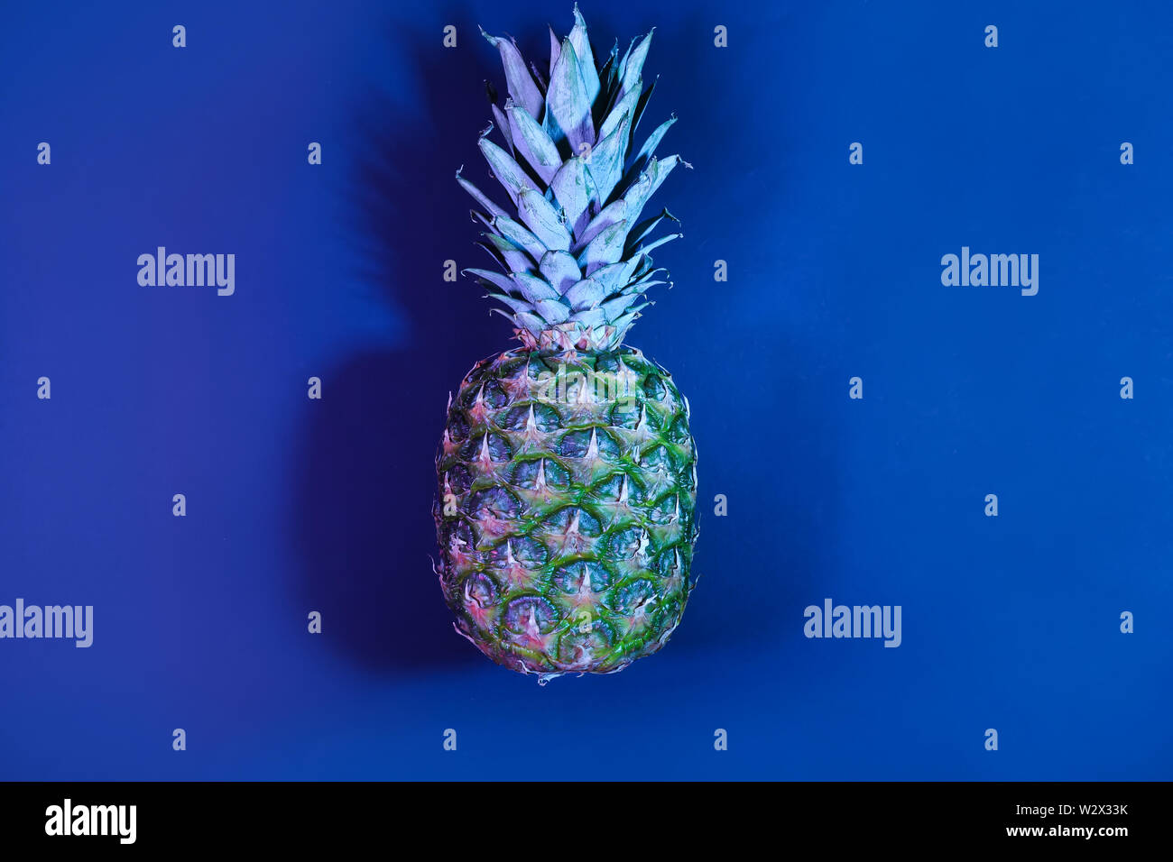 Tasty ripe pineapple on color background Stock Photo - Alamy