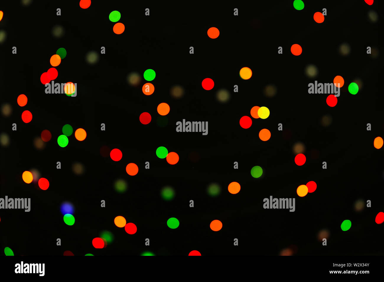 Colorful defocused lights on dark background Stock Photo - Alamy