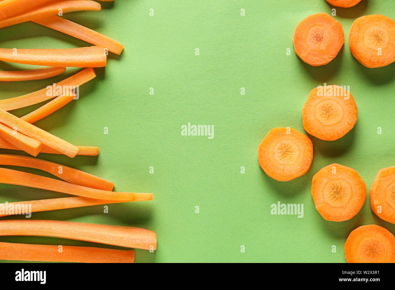 Fresh cut carrot on color background Stock Photo - Alamy