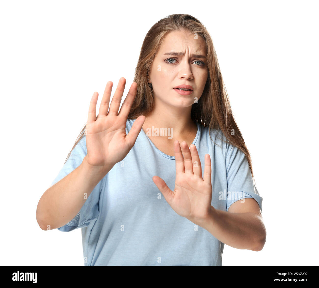 Woman having panic attack on white background Stock Photo - Alamy