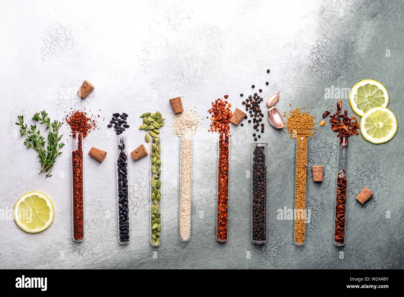 Assortment of spices in tubes on light background Stock Photo - Alamy