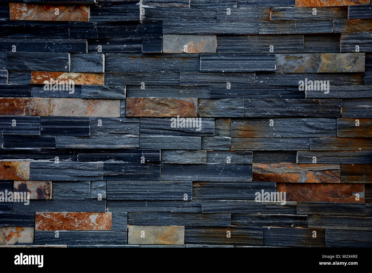 Stones Wall with beautiful colors contrast Stock Photo - Alamy