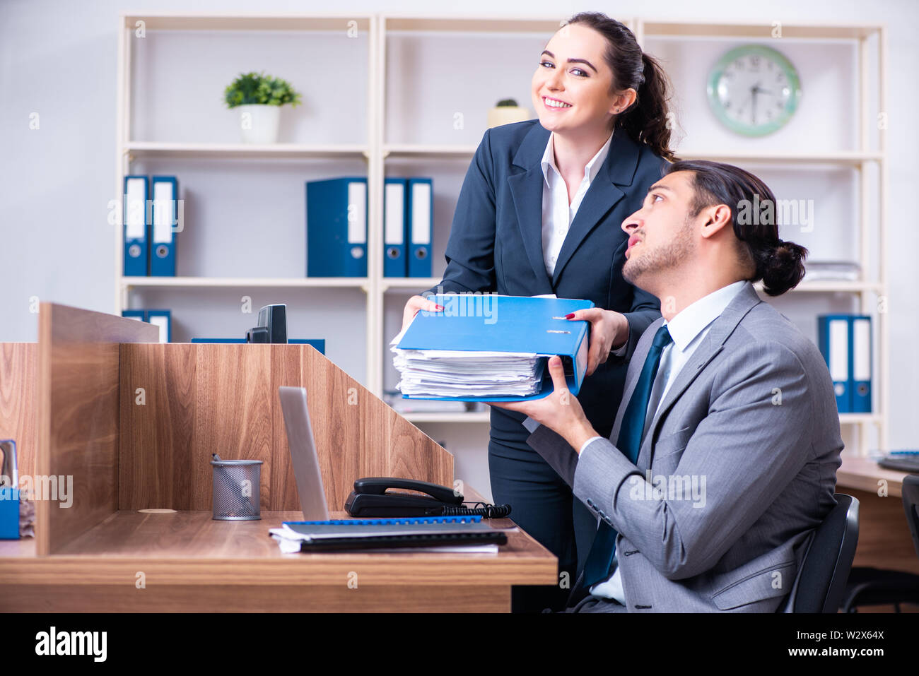 The two employees working in the office Stock Photo - Alamy