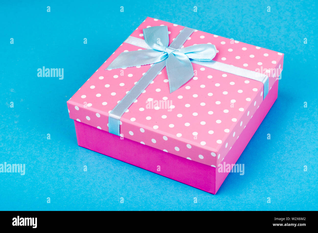 Square box of pink polka dots on bright background Stock Photo - Alamy