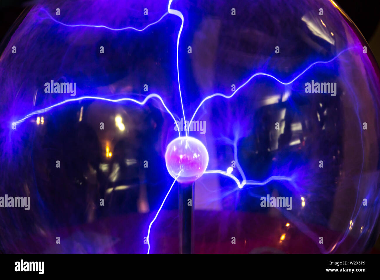 Plasma ball with smooth magenta - blue flames Stock Photo - Alamy