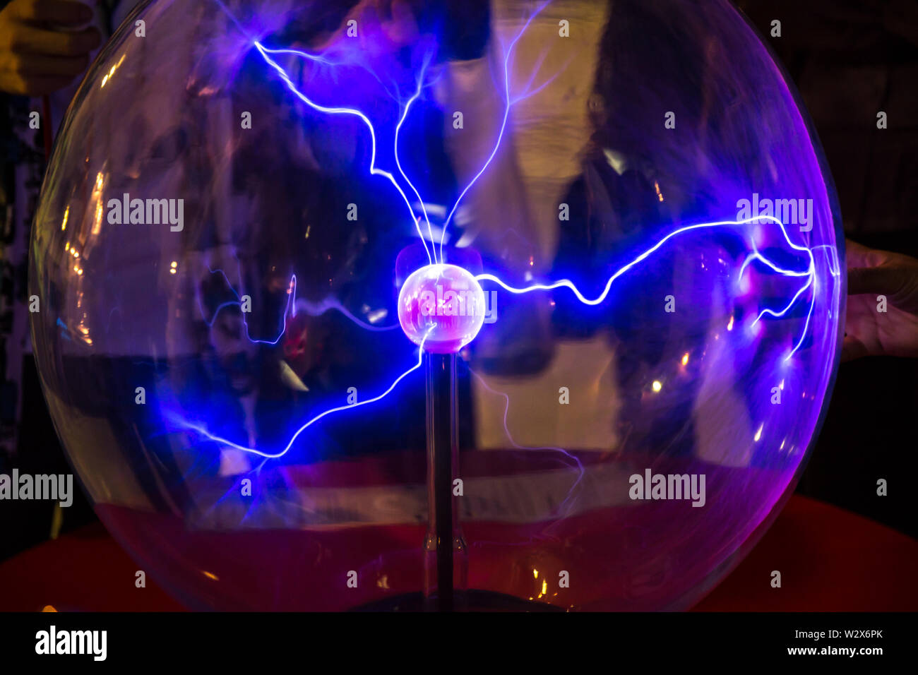 Plasma ball with smooth magenta - blue flames Stock Photo - Alamy