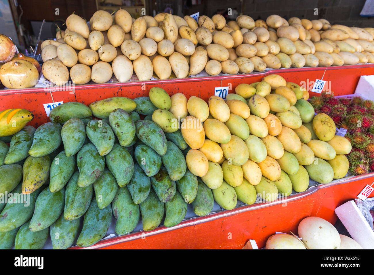 Yellow Mango on Thailand market - exotic thai fruits Stock Photo - Alamy