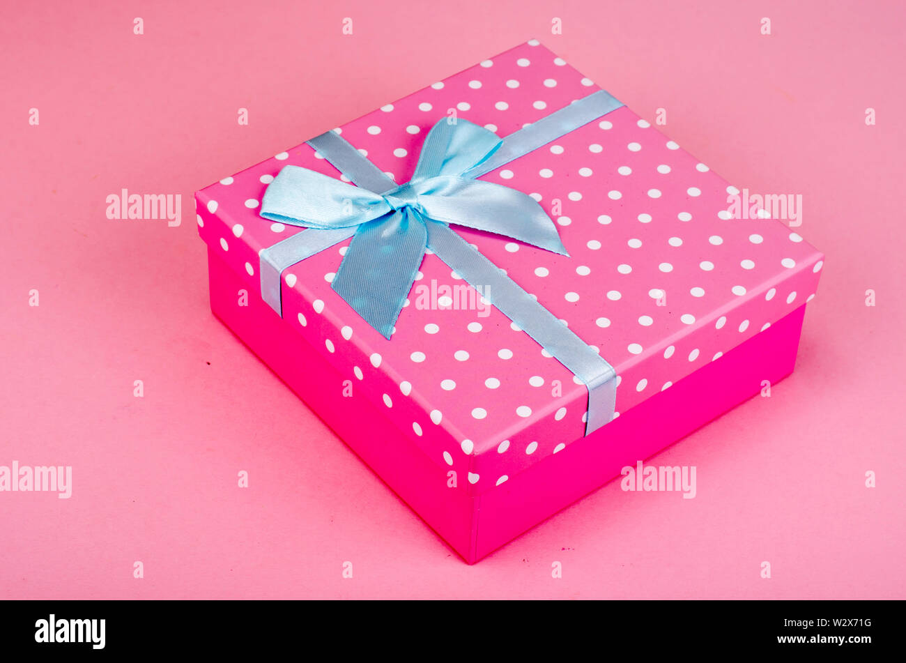 Square box of pink polka dots on bright background Stock Photo - Alamy