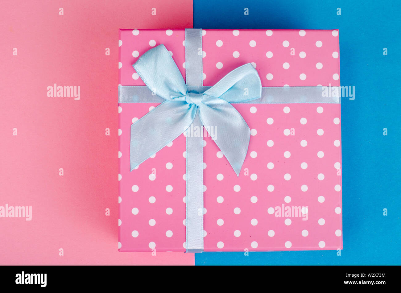 Square box of pink polka dots on bright background Stock Photo - Alamy