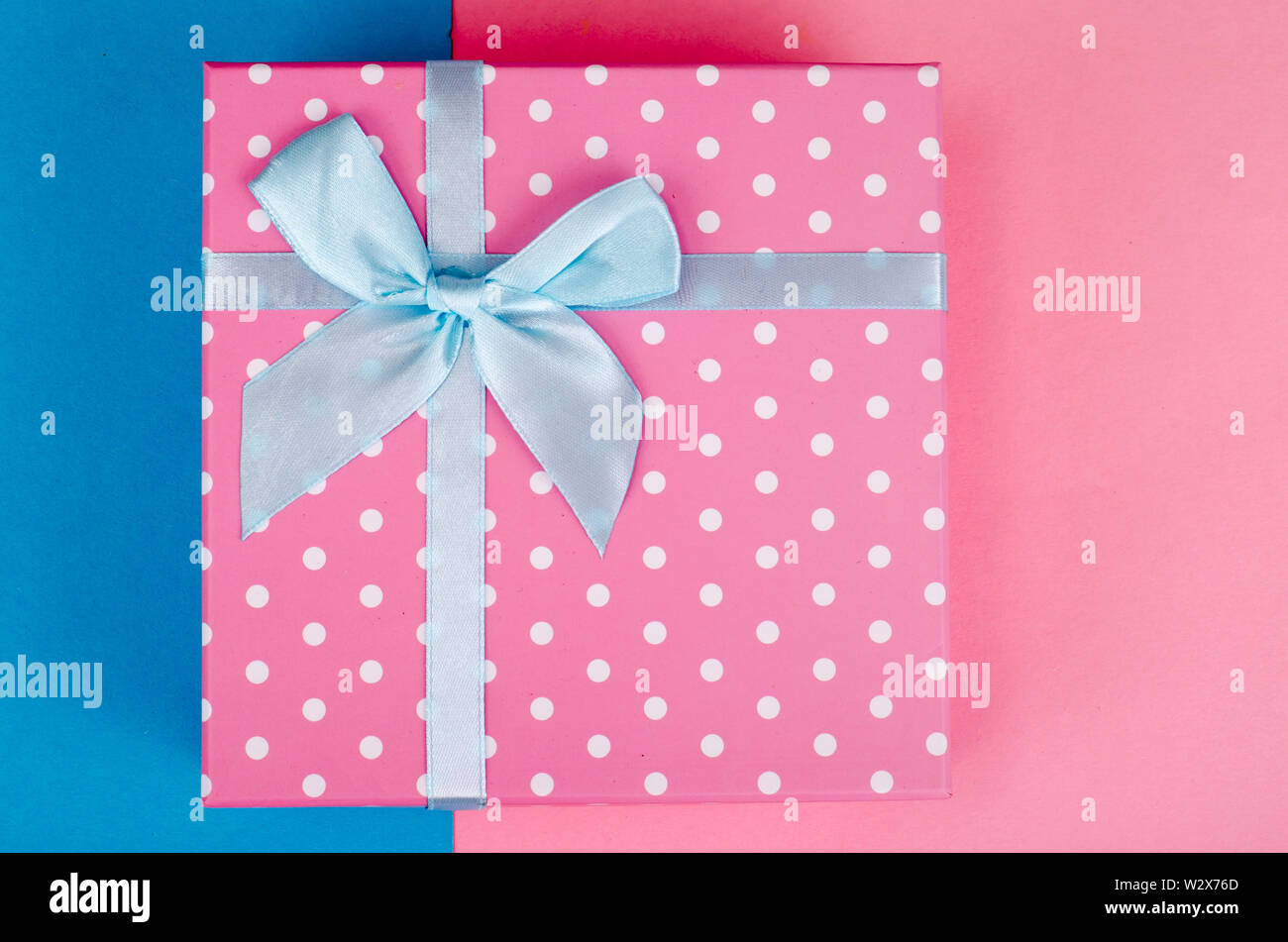 Square box of pink polka dots on bright background Stock Photo - Alamy