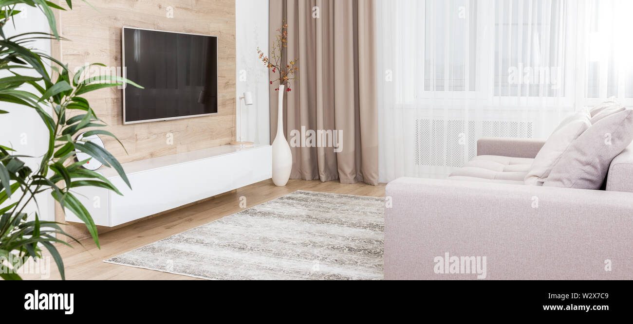 Panoramic picture of a spacious living room full of light Stock Photo ...