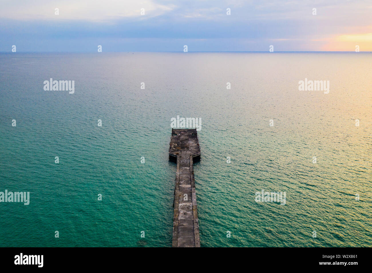 The jetty in the sea with the horizontal sea line by minimal drone ...