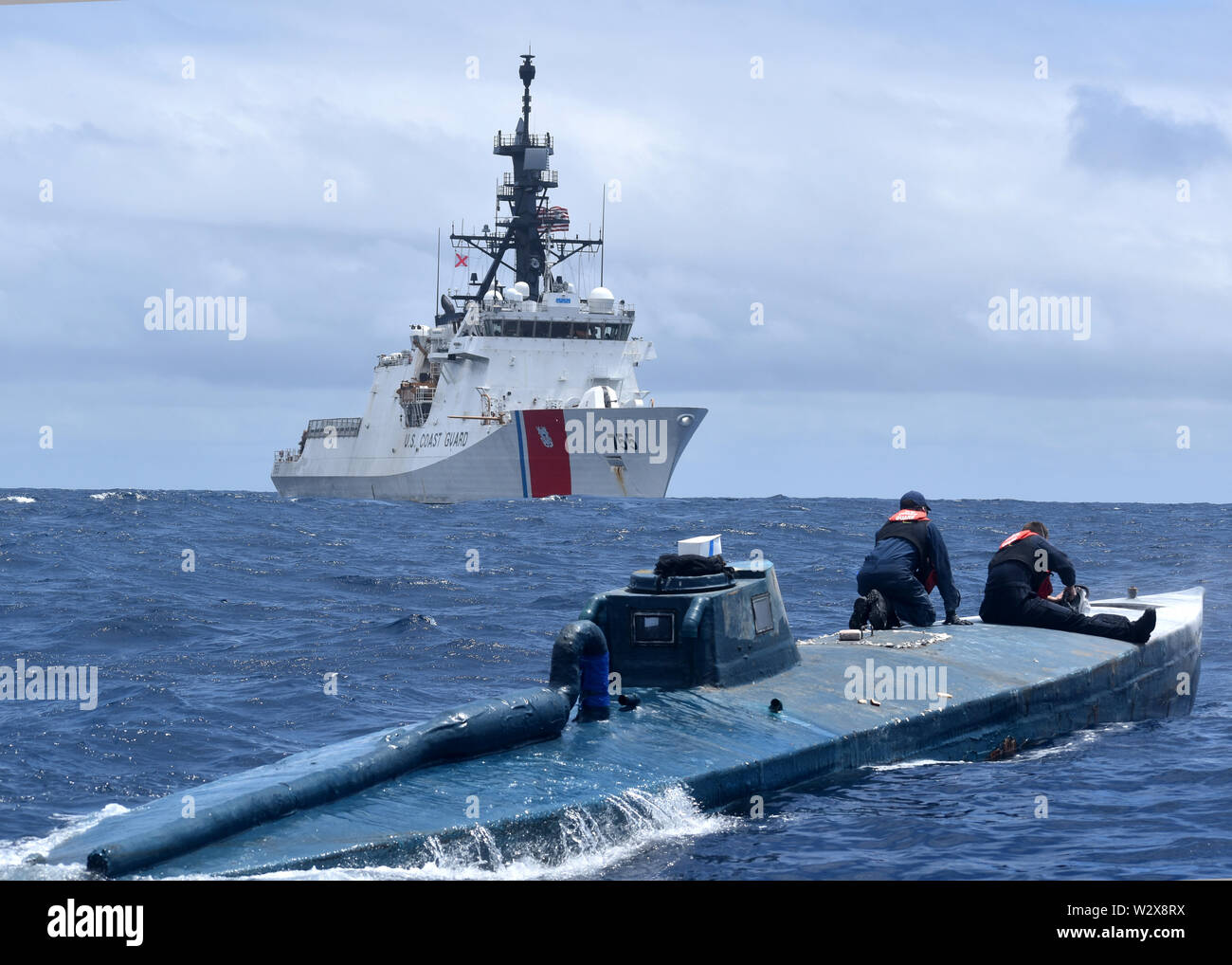 U.S. Coast Guard Cutter Munro (WMSL 755) crew members inspect a self ...