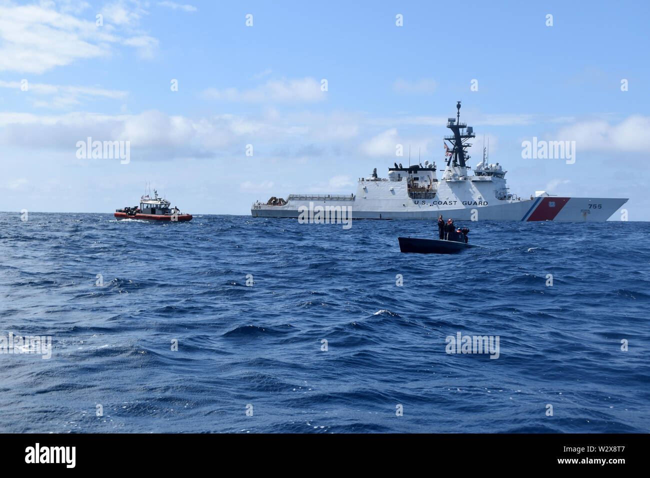 U.S. Coast Guard Cutter Munro (WMSL 755) crew members inspect a self ...