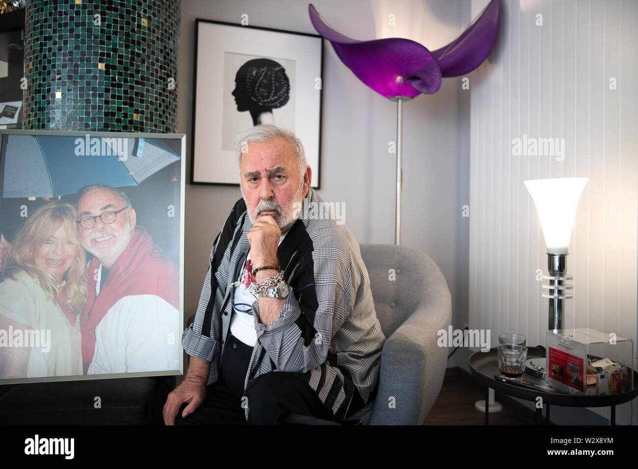 Berlin, Germany. 10th July, 2019. Udo Walz sits in his salon on ...
