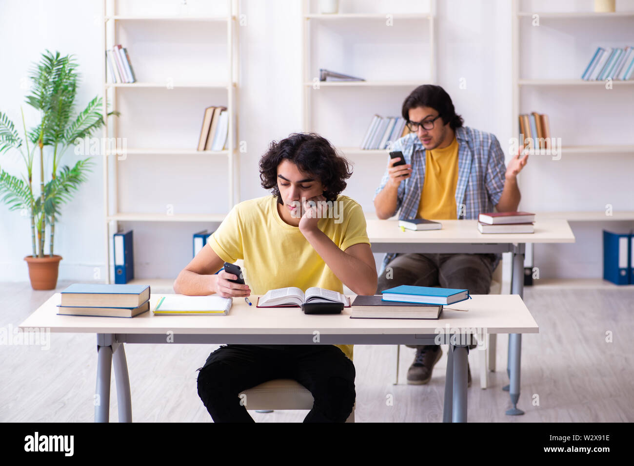 The two male students in the classroom Stock Photo - Alamy