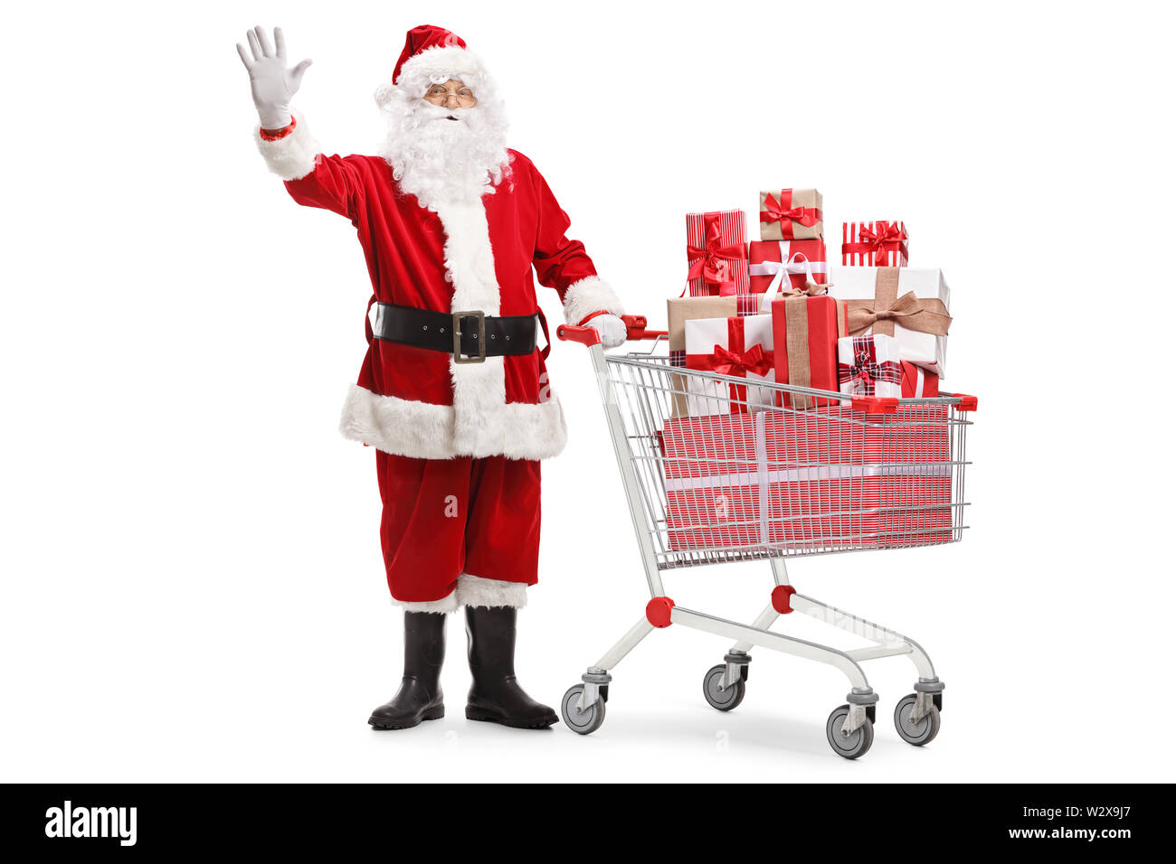 Full length portrait of santa claus standing with a shopping cart full ...