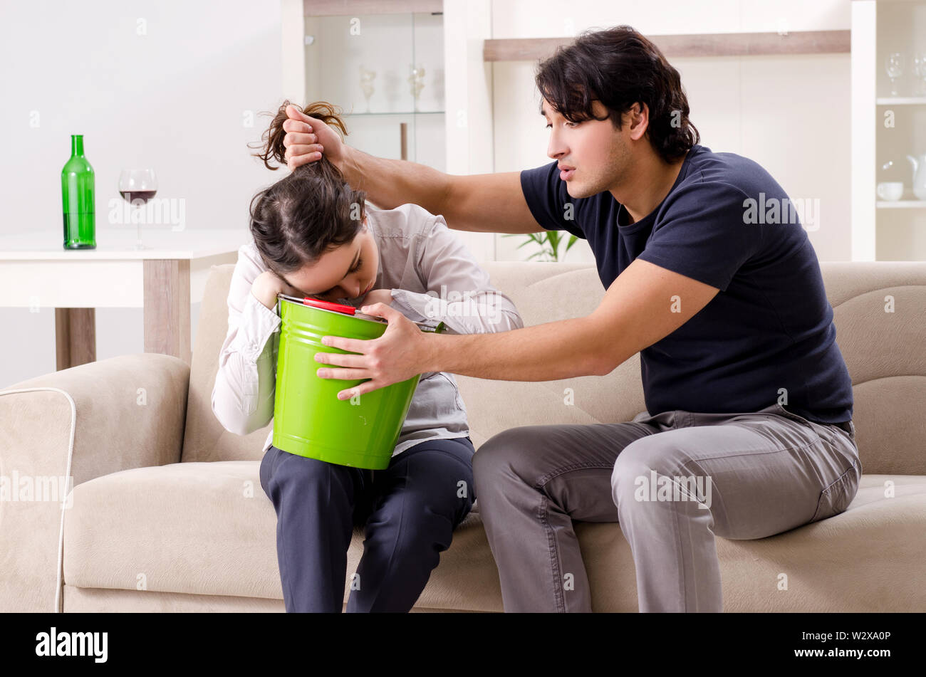 The young wife suffering from sick stomach and vomiting Stock Photo - Alamy
