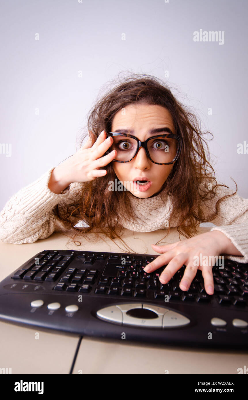 The funny nerd girl working on computer Stock Photo - Alamy