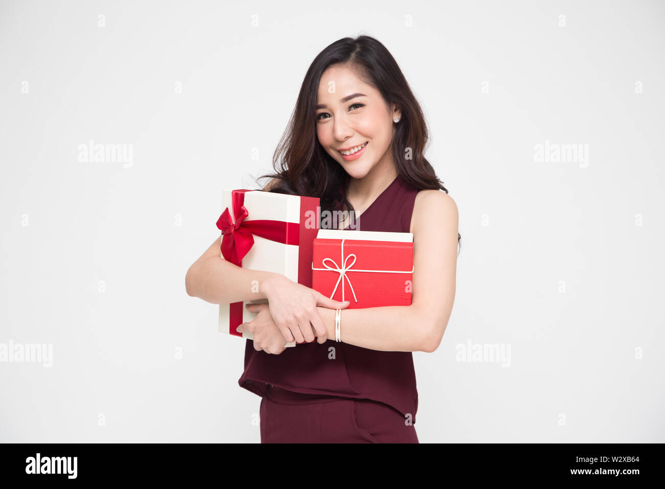 Asian beautiful women smiling and hugging gift boxes isolated on white ...