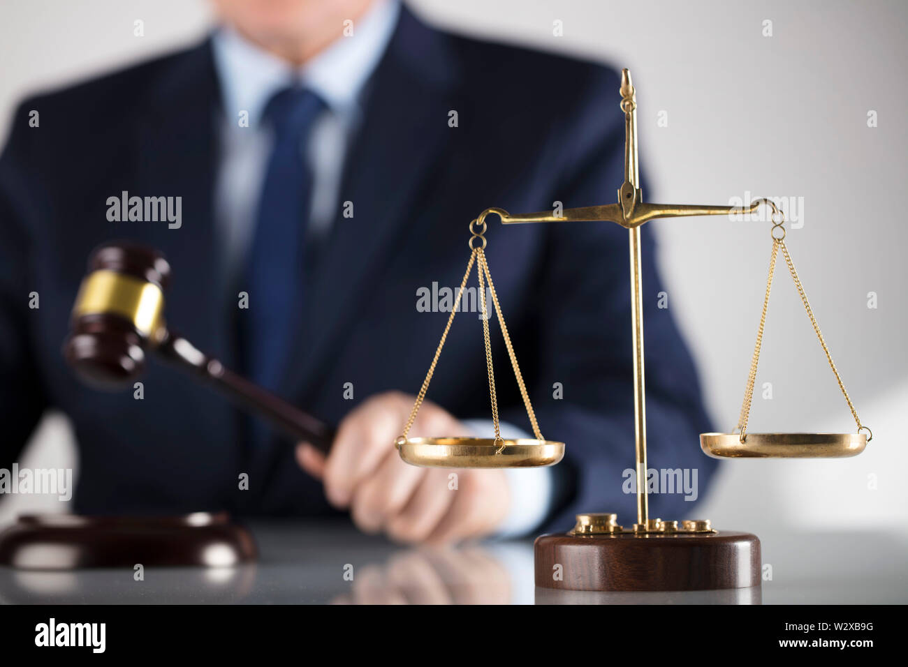 Judge in the courtroom. Male judge striking the gavel Stock Photo - Alamy