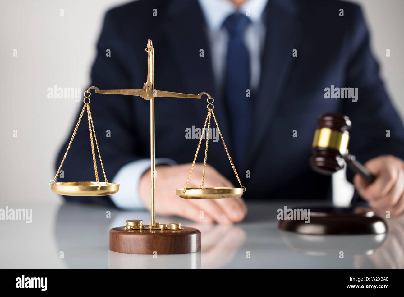 Judge in the courtroom. Male judge striking the gavel Stock Photo - Alamy
