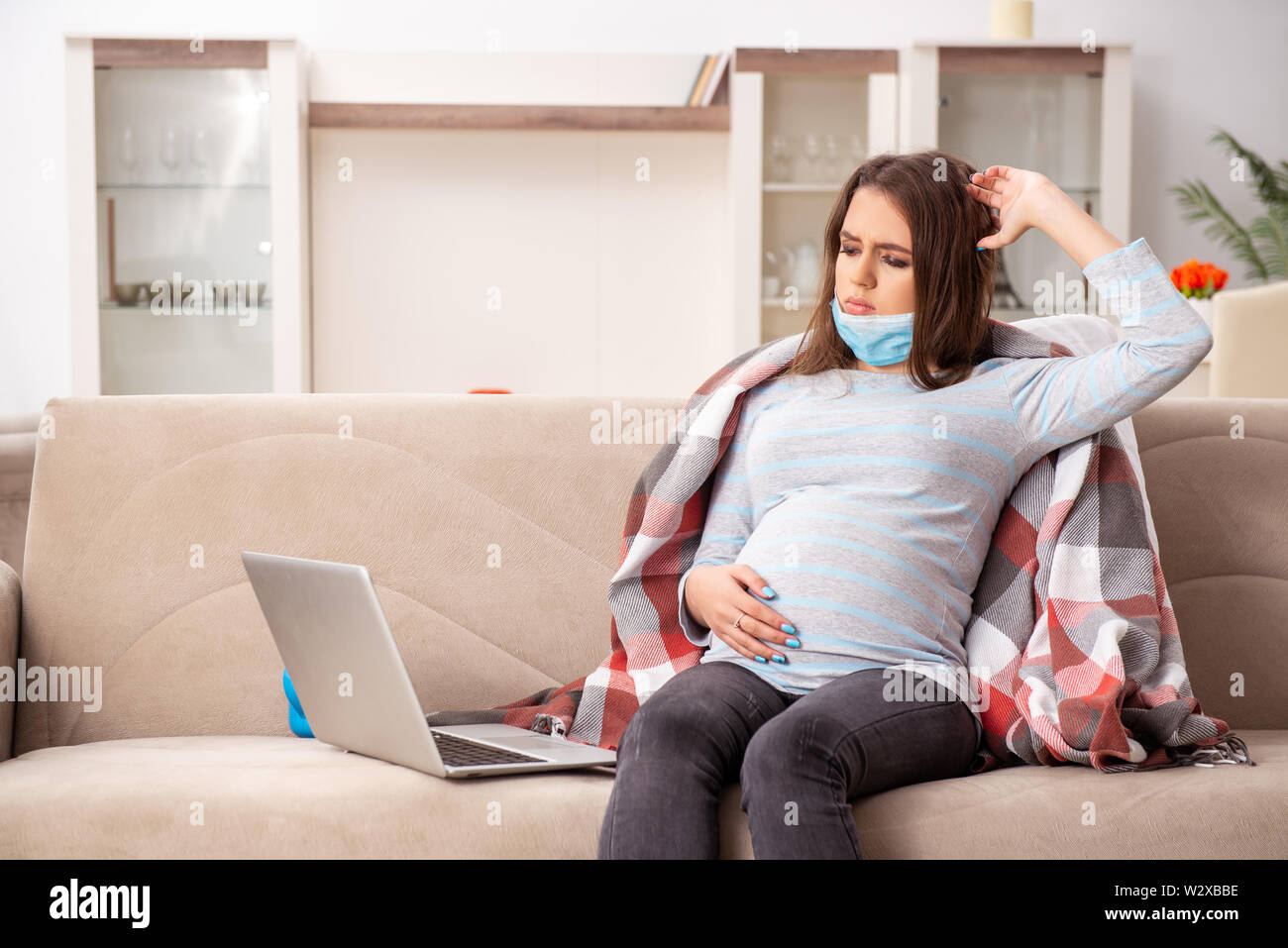 The sick pregnant woman suffering at home Stock Photo - Alamy