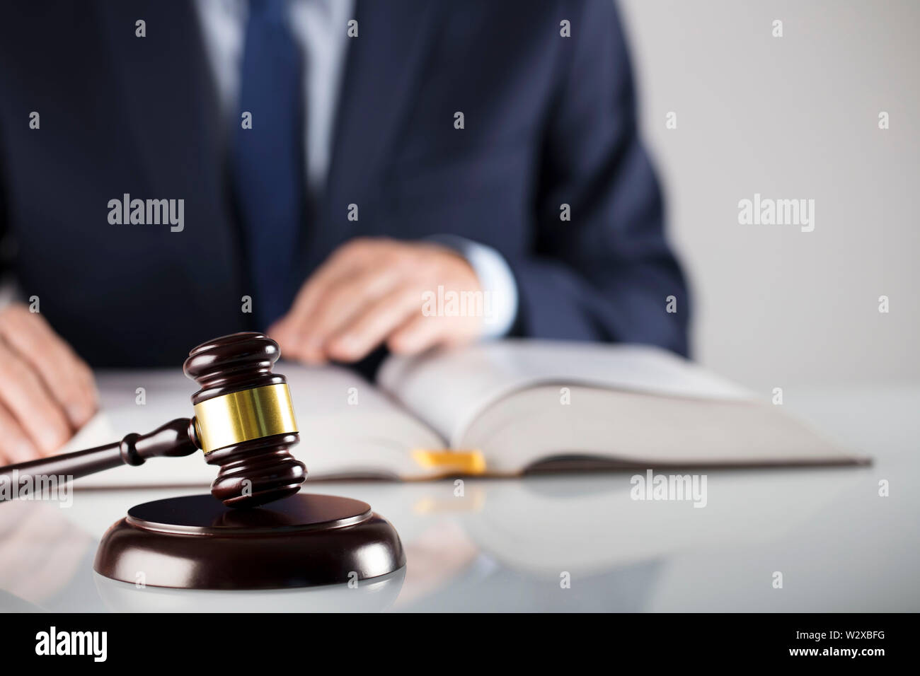 Judge in the courtroom. Male judge striking the gavel Stock Photo - Alamy