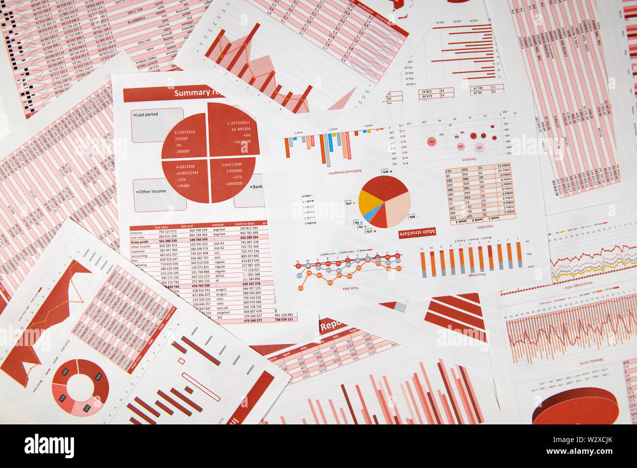 Flat top view of business workspace - reports with data, tables and ...