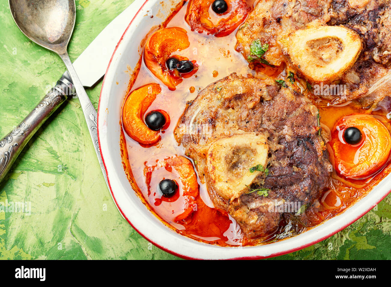 Ossobuco, traditional dish of Italian cuisine.Stewed veal leg.Meat stew ...