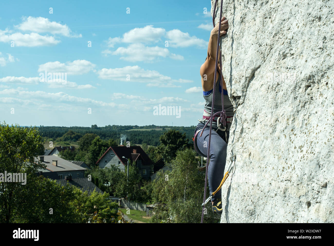 Women climbing vertical wall, Poland Stock Photo - Alamy