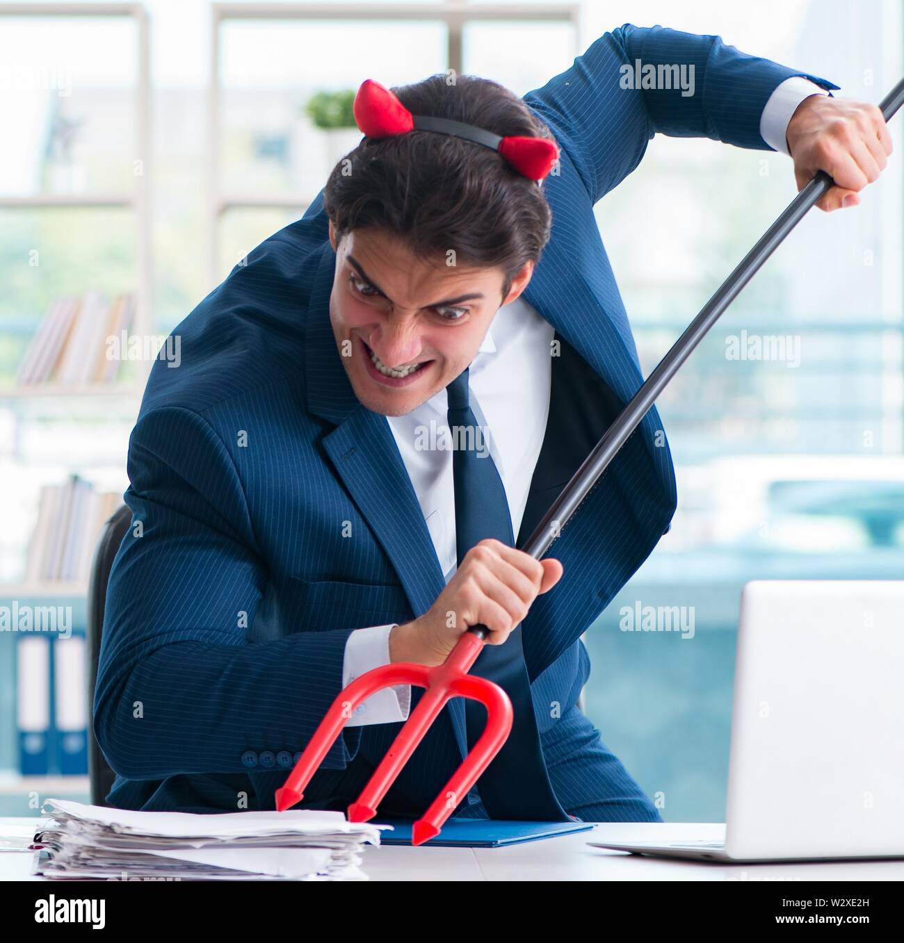 The devil angry businessman in the office Stock Photo - Alamy